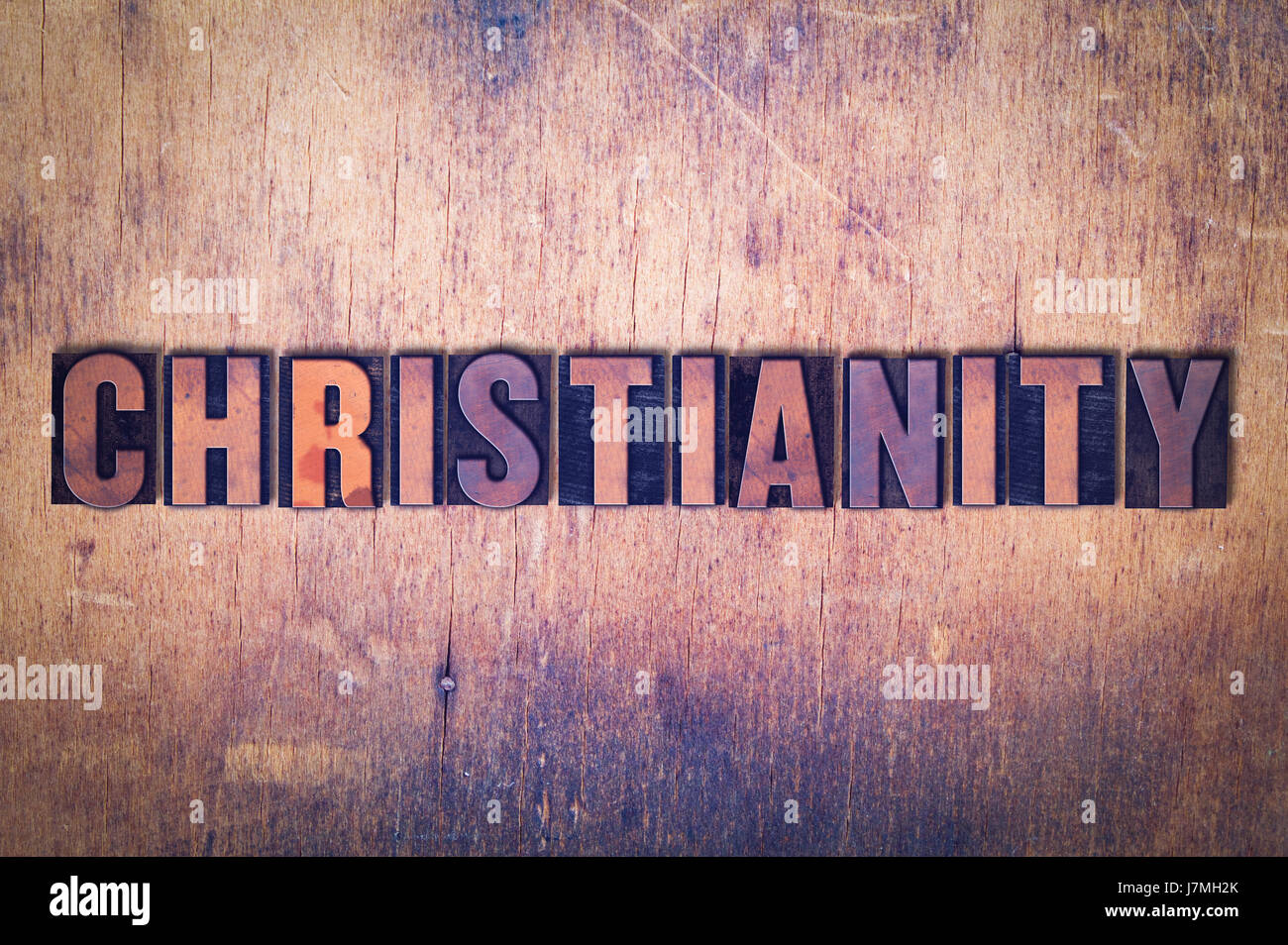 The word Christianity concept and theme written in vintage wooden ...