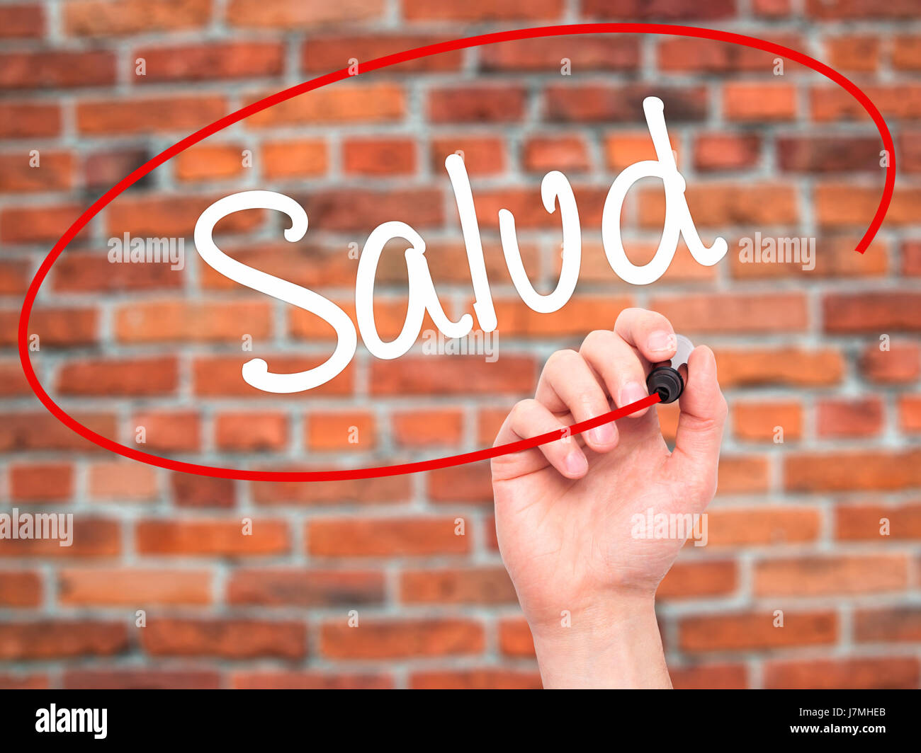 Man Hand writing Salud (Health in Spanish) with black marker on visual ...