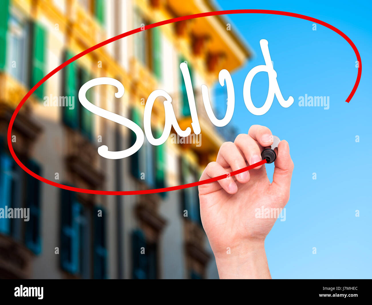 Man Hand writing Salud (Health in Spanish) with black marker on visual ...