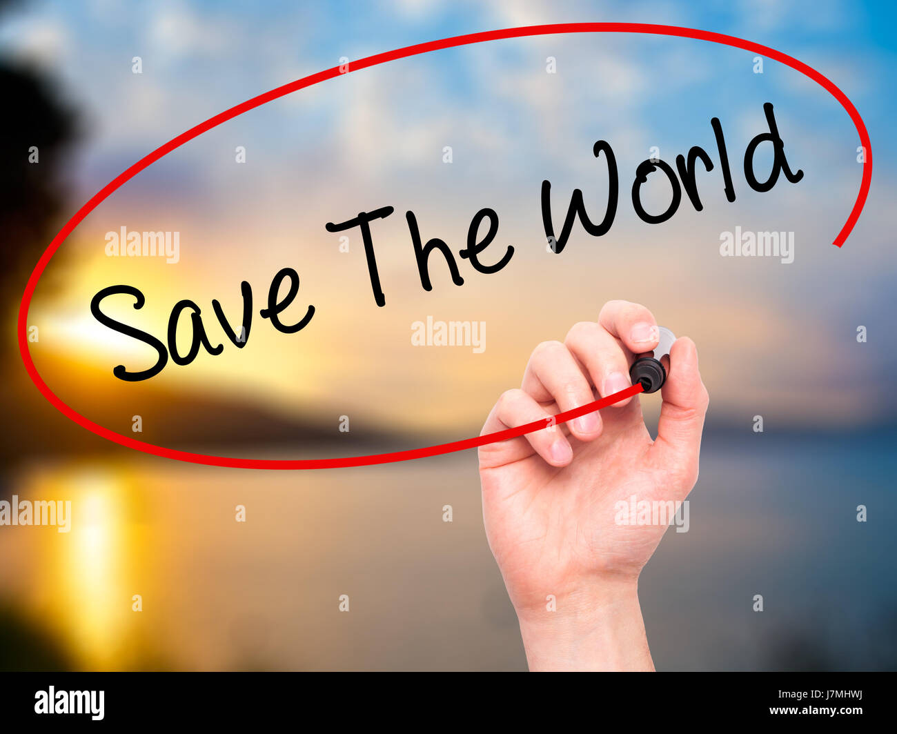 Man Hand writing Save The World with black marker on visual screen ...
