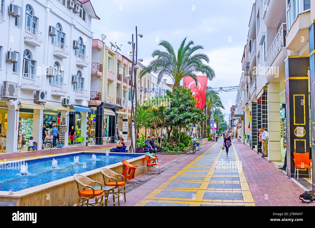 KEMER, TURKEY - MAY 5, 2017: The evening walk along Munir Ozkul Liman ...