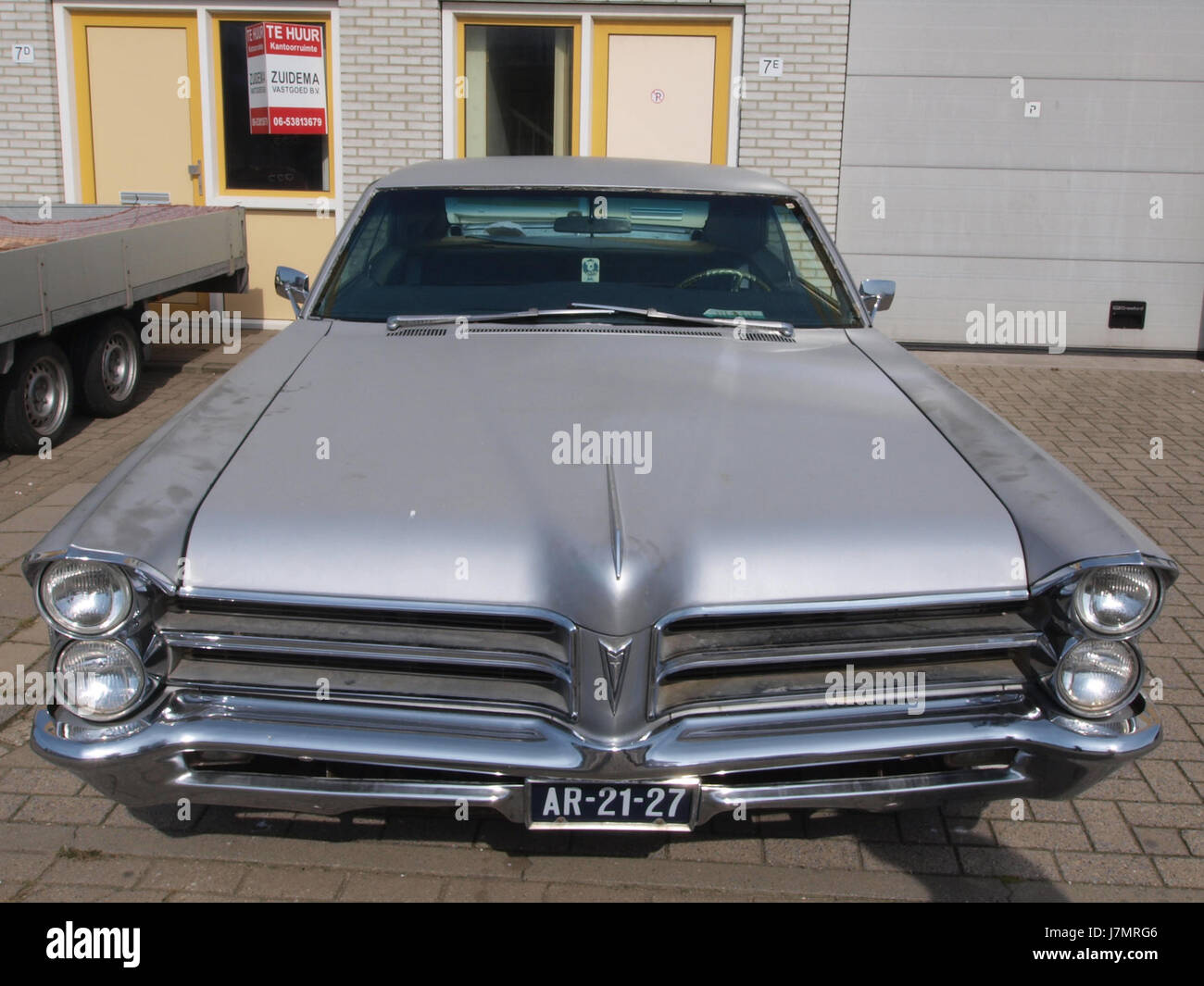 This image showcases a 1965 Pontiac Catalina, an iconic American muscle ...
