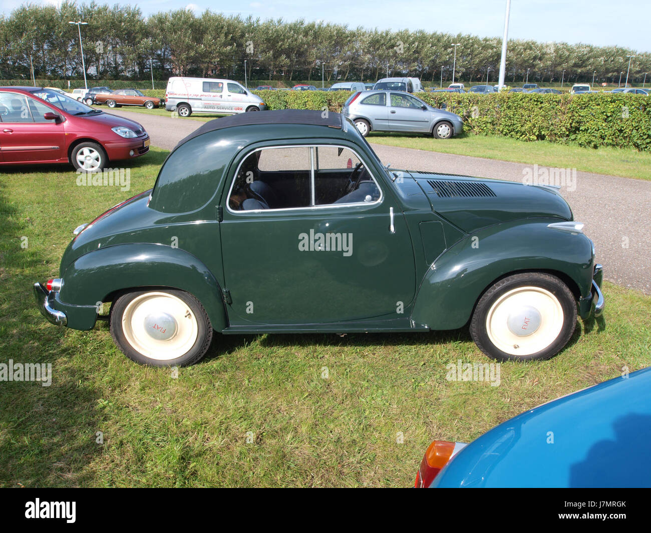 The 1952 Fiat 500C is a classic compact car from Italy, known for its ...