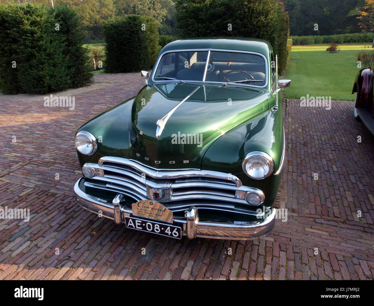 This image features a 1950 Dodge Coronet, a classic car model renowned ...