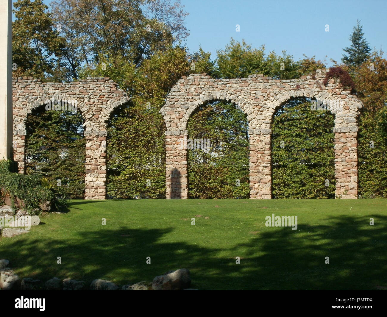 This image captures the Roman aqueduct in Schwetzingen, Germany, a part ...
