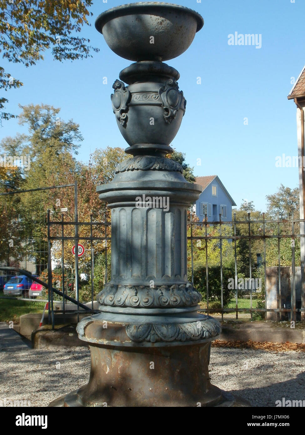 This photograph captures a lantern post (Laternenfuss) on ...