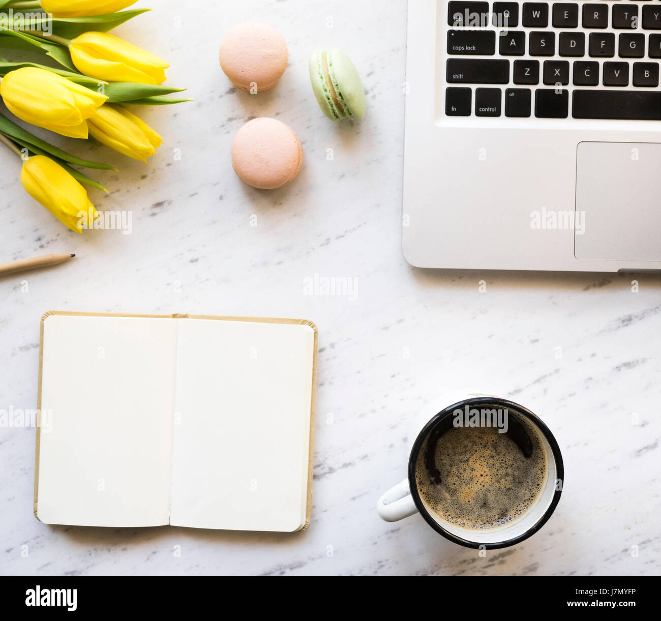 Office desk table with laptop, cup of coffee and flowers Stock Photo ...