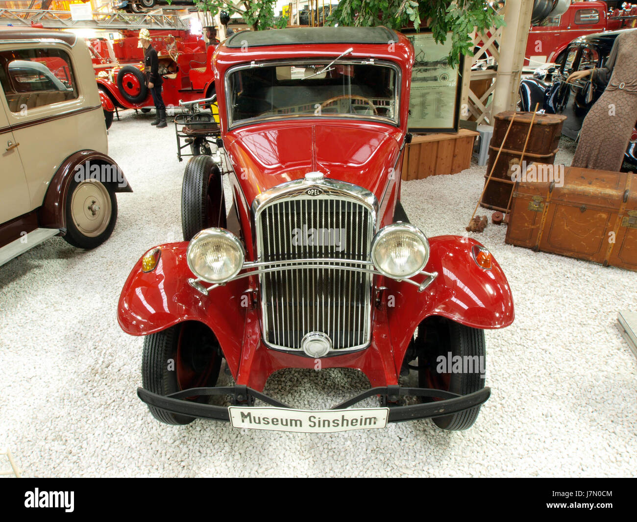 This image features a 1932 Opel 1.2 Limousine, a classic car known for ...