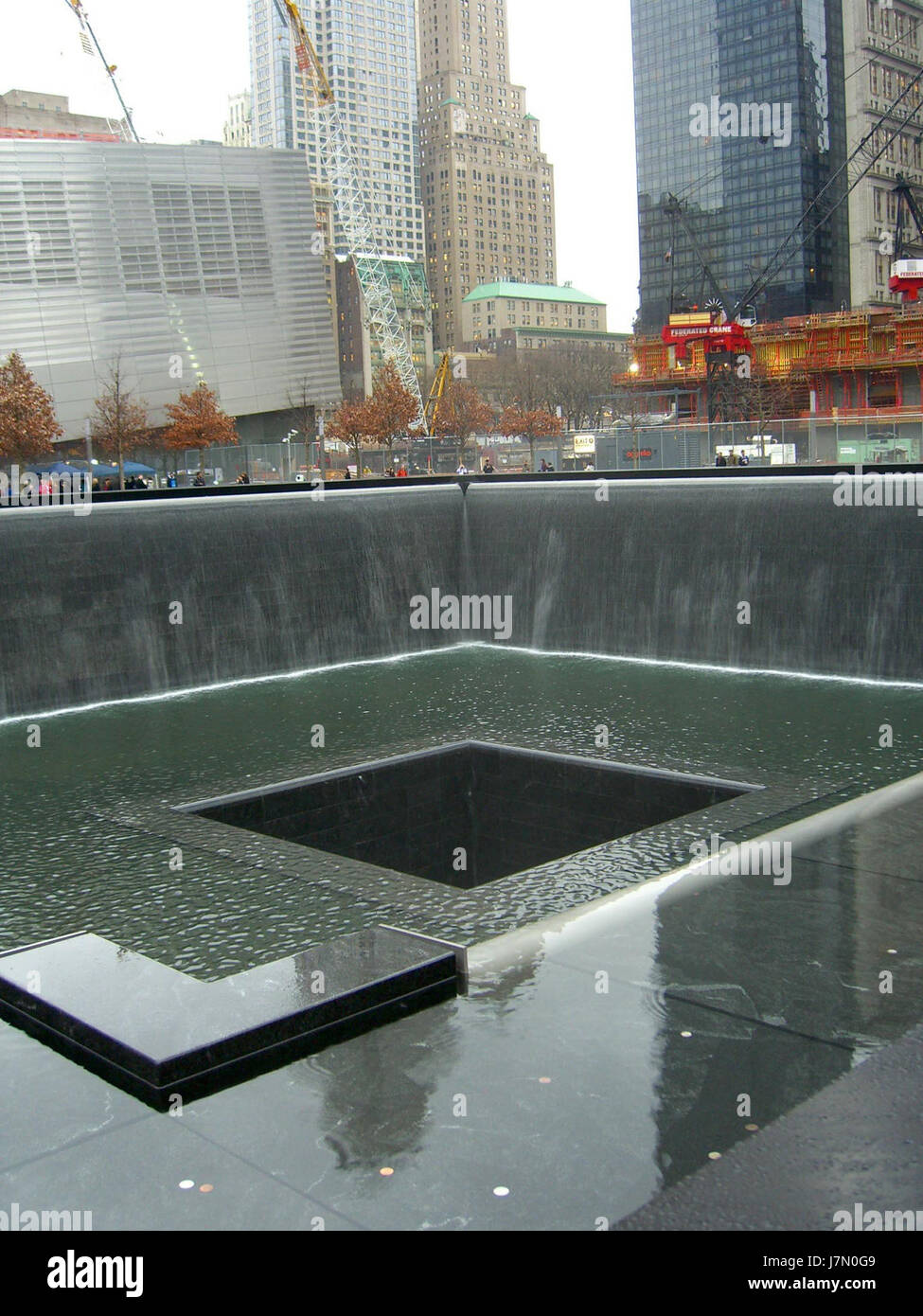This image captures the South Pool of the National 9/11 Memorial ...