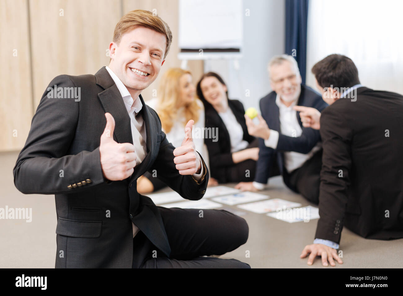 Nice positive man showing OK sign Stock Photo - Alamy
