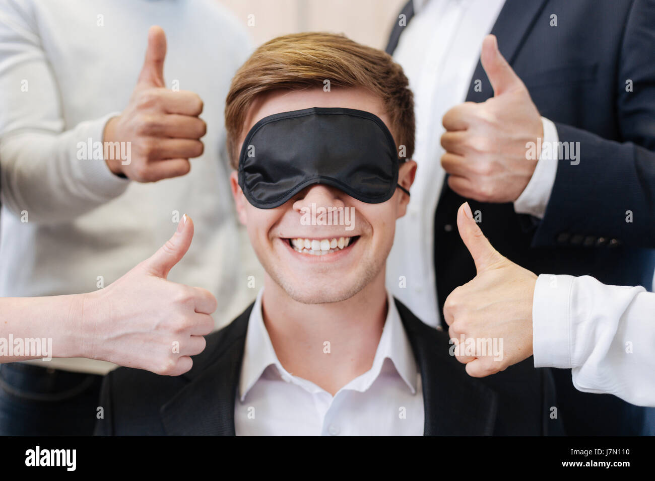 Happy handsome man feeling the support of his colleagues Stock Photo ...