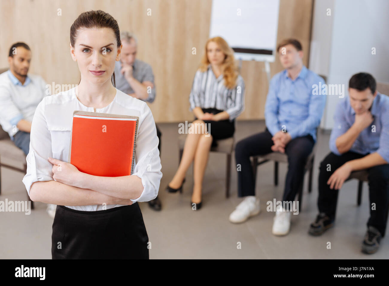 Serious beautiful woman looking at you Stock Photo - Alamy