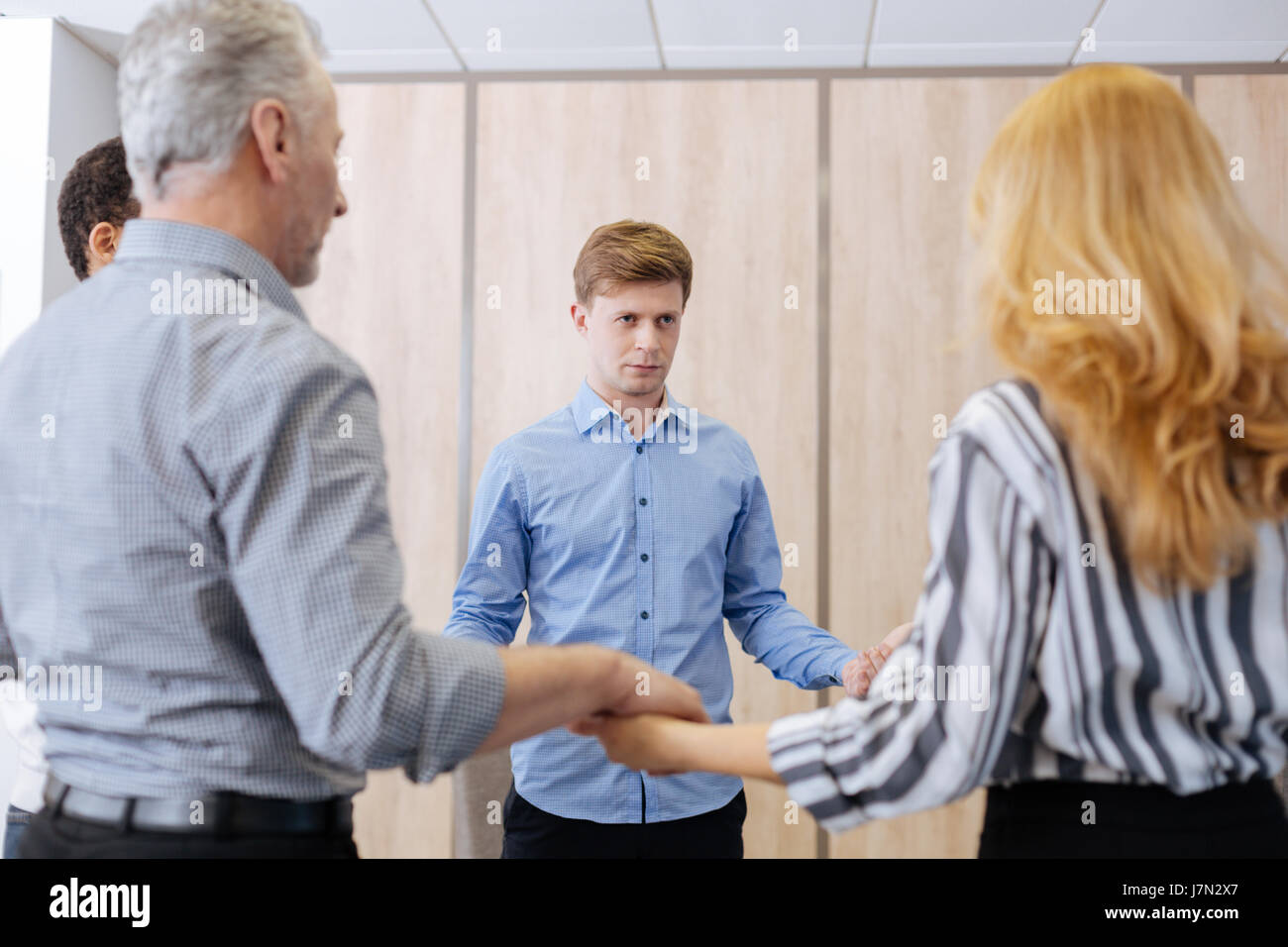 Pleasant nice people standing in the circle Stock Photo - Alamy