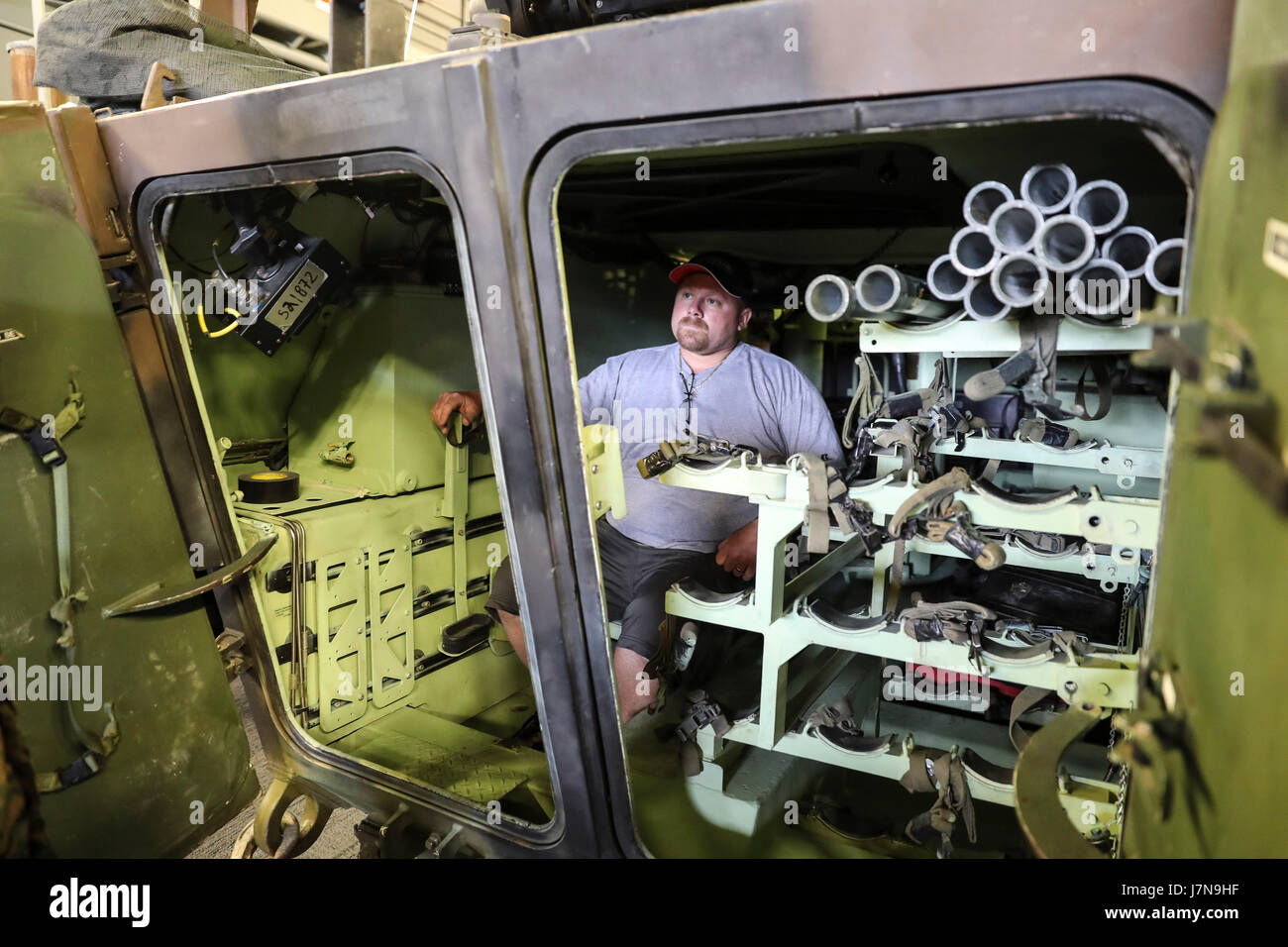 New York, USA. 25th May, 2017. A man sits in a military vehicle inside ...