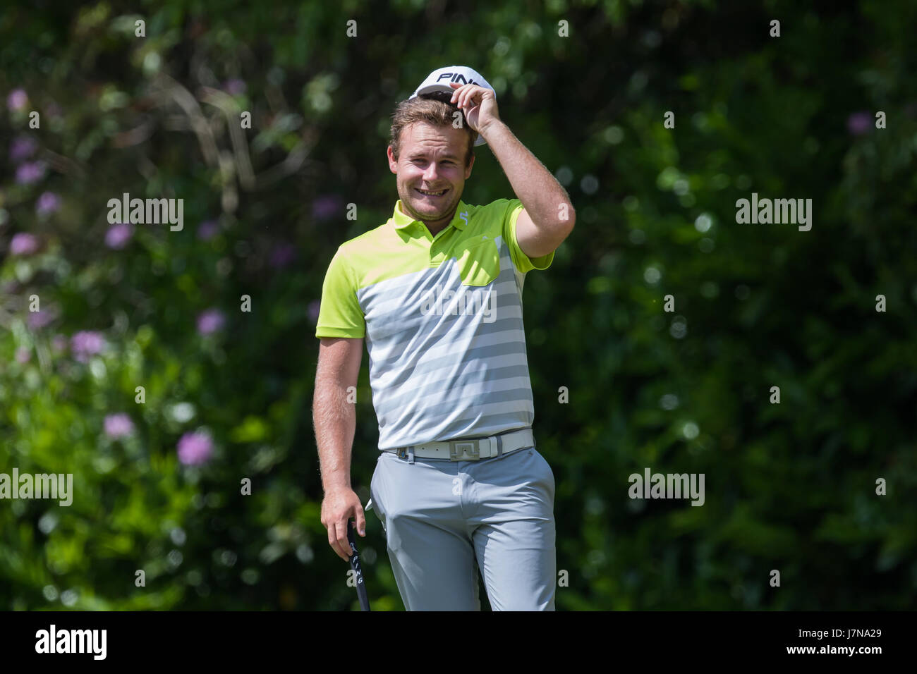 Wentworth, Britain. 25th May, 2017. Tyrrell Hatton of England competes ...