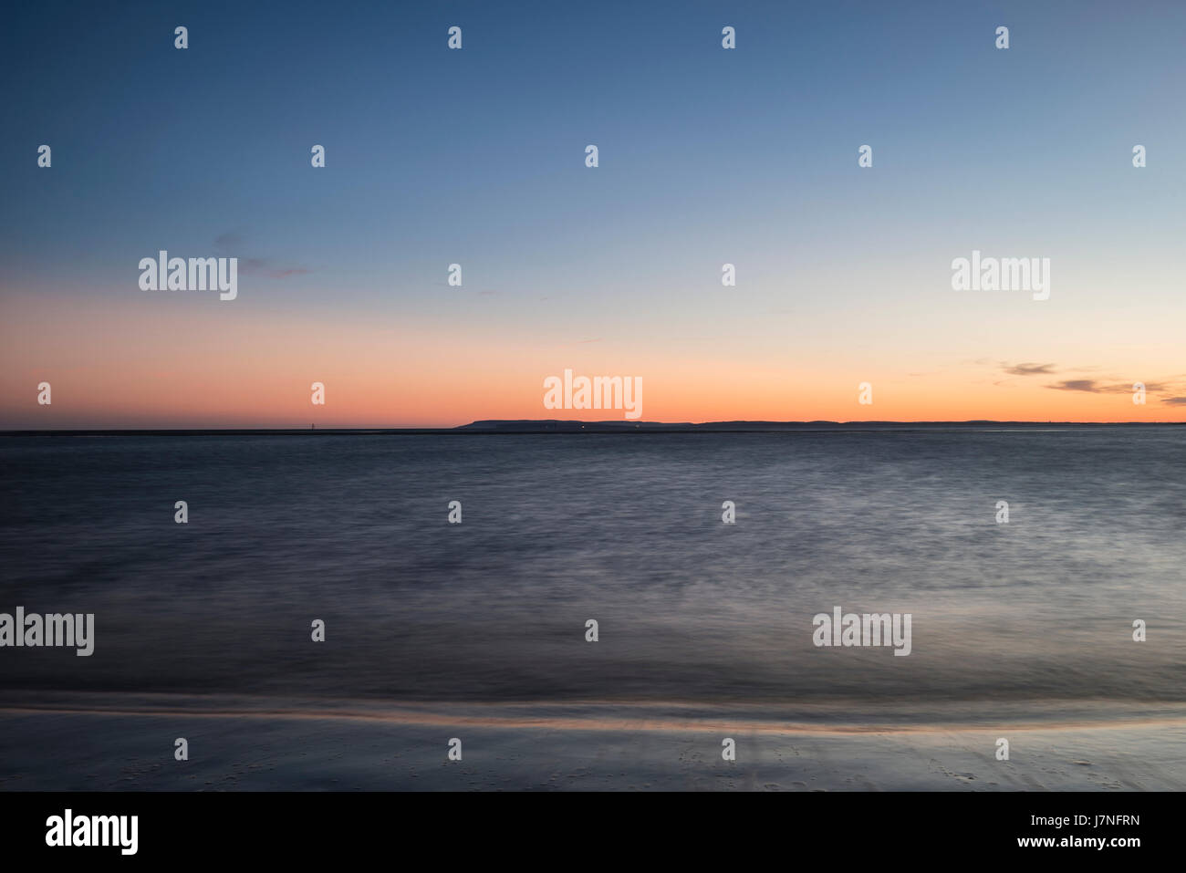 Beautiful Spring sunset long exposure beach landscape Stock Photo - Alamy