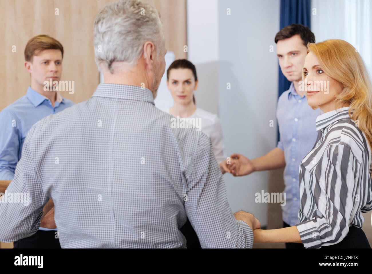 Good looking nice people looking at each other Stock Photo - Alamy