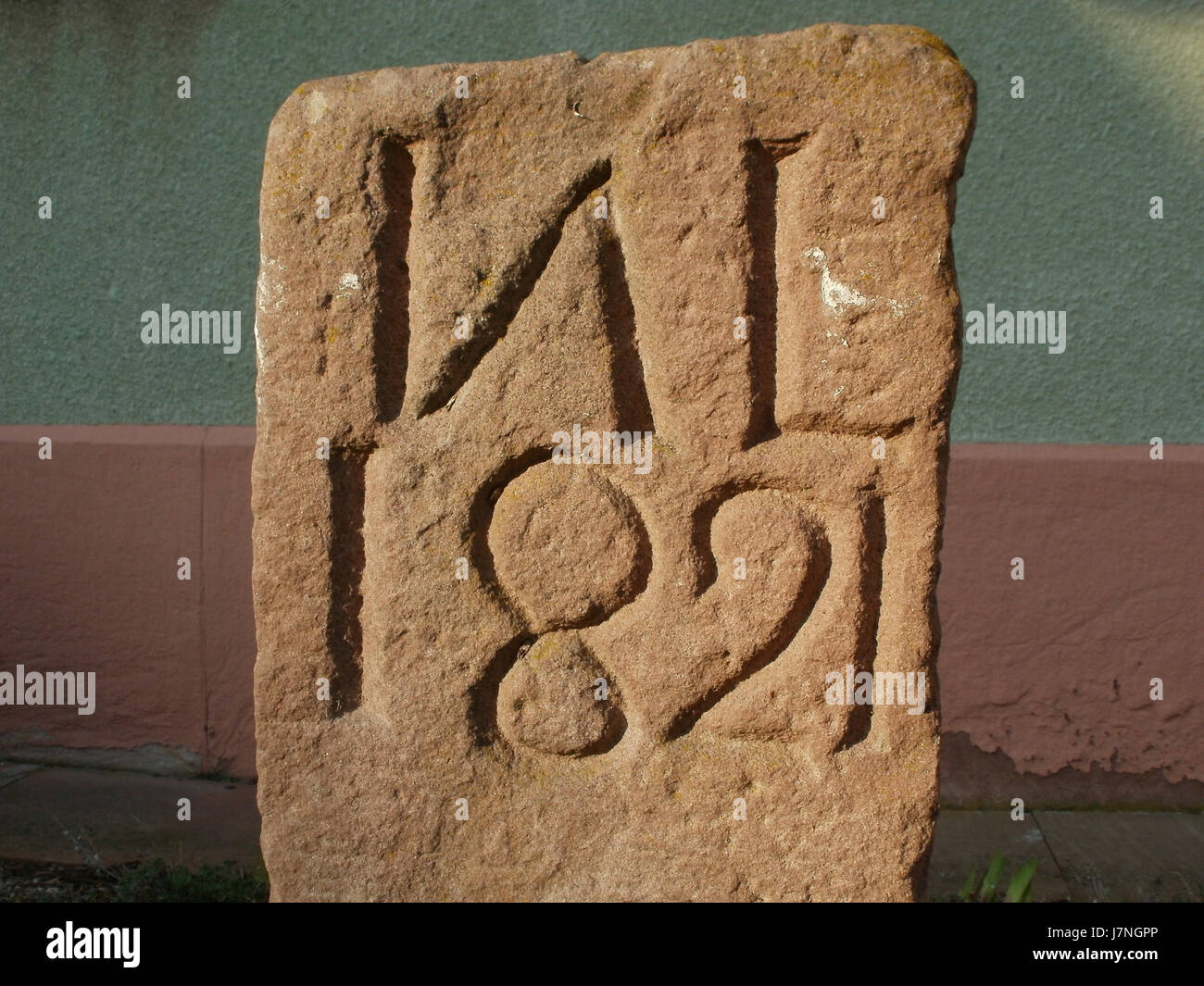 A photograph of a boundary stone (Grenzstein) in Altlussheim, Germany ...