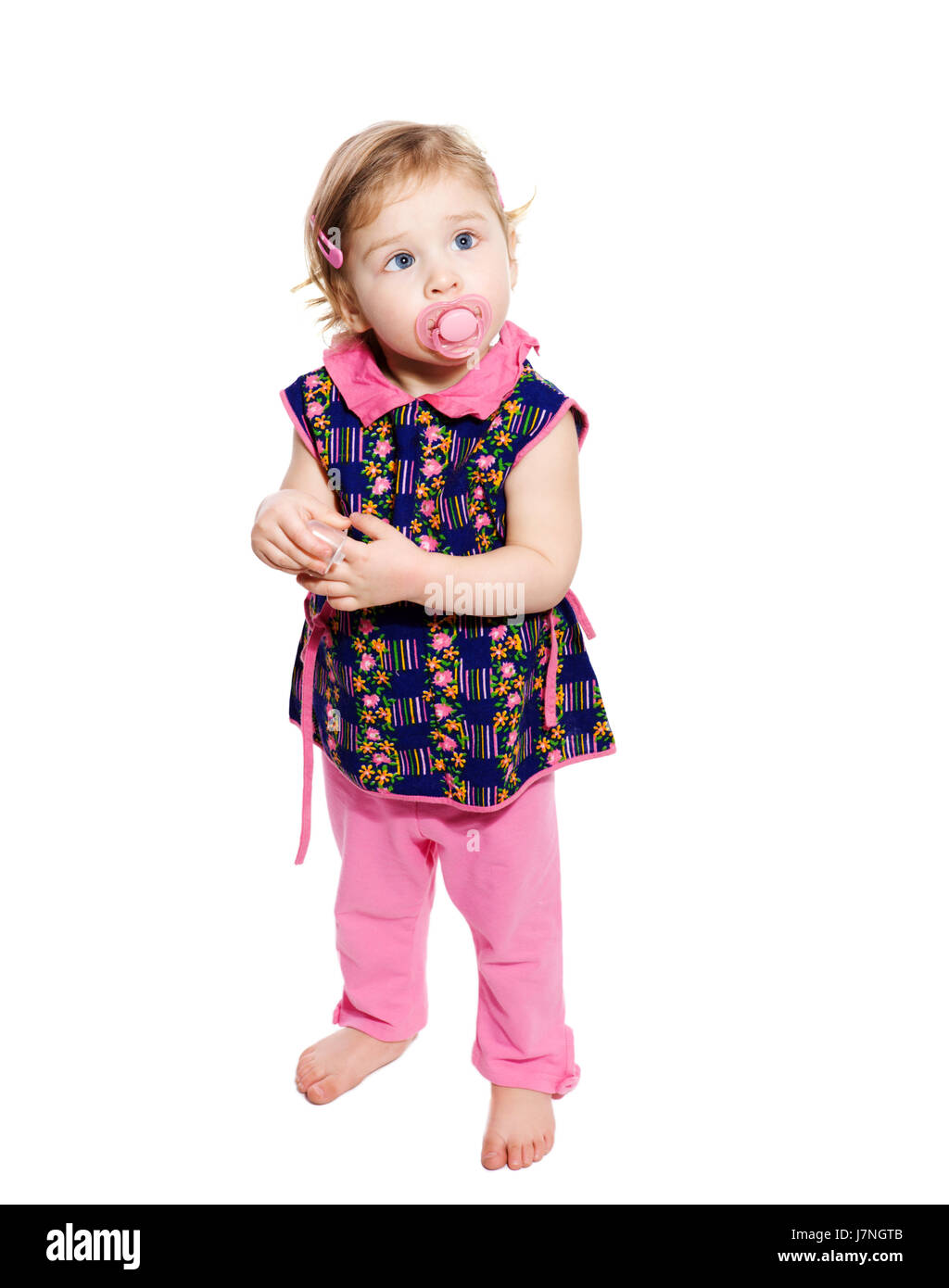 Little girl wearing pink clothes isolated on white Stock Photo - Alamy