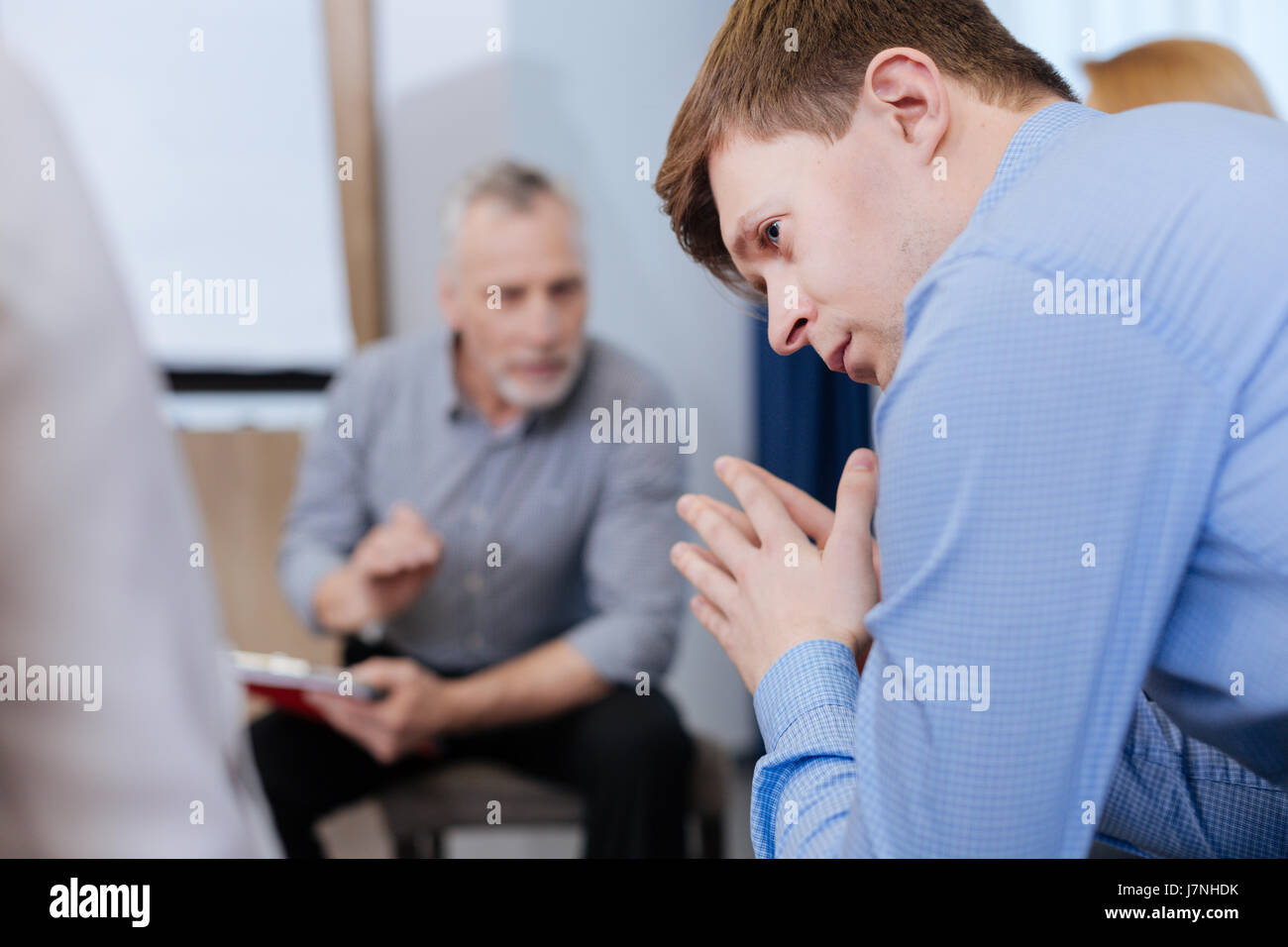 Thoughtful good looking man having problems at work Stock Photo - Alamy