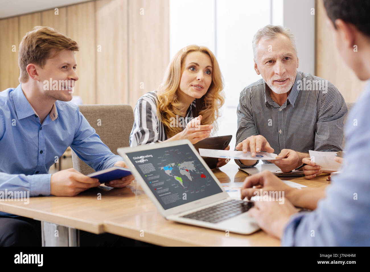 Nice hard working man using a laptop Stock Photo - Alamy