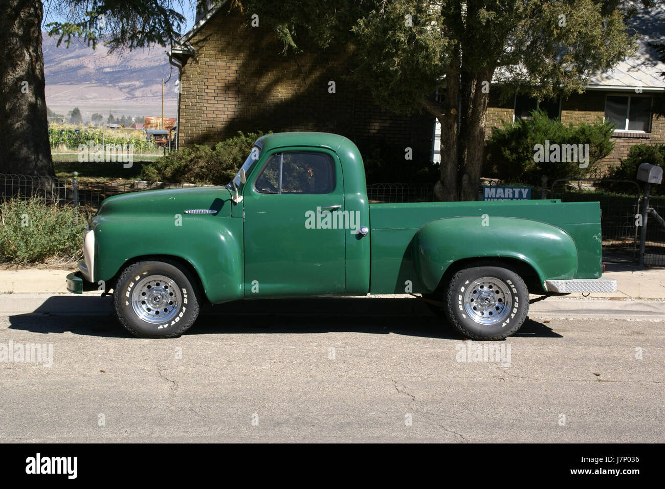 This image captures a 1954 Studebaker pickup truck, a classic American ...