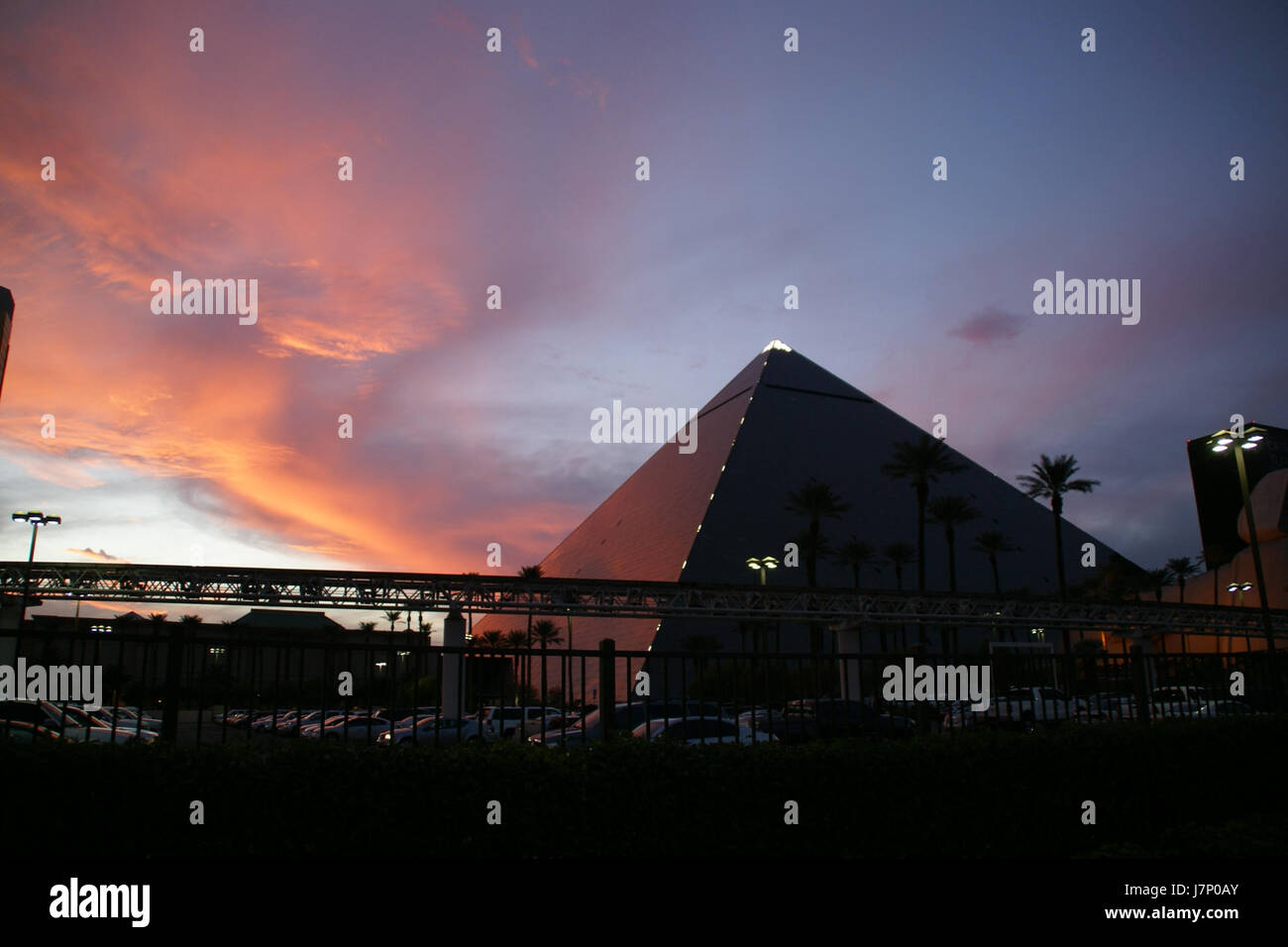 The photograph captures the Luxor Hotel in Las Vegas during nightfall ...