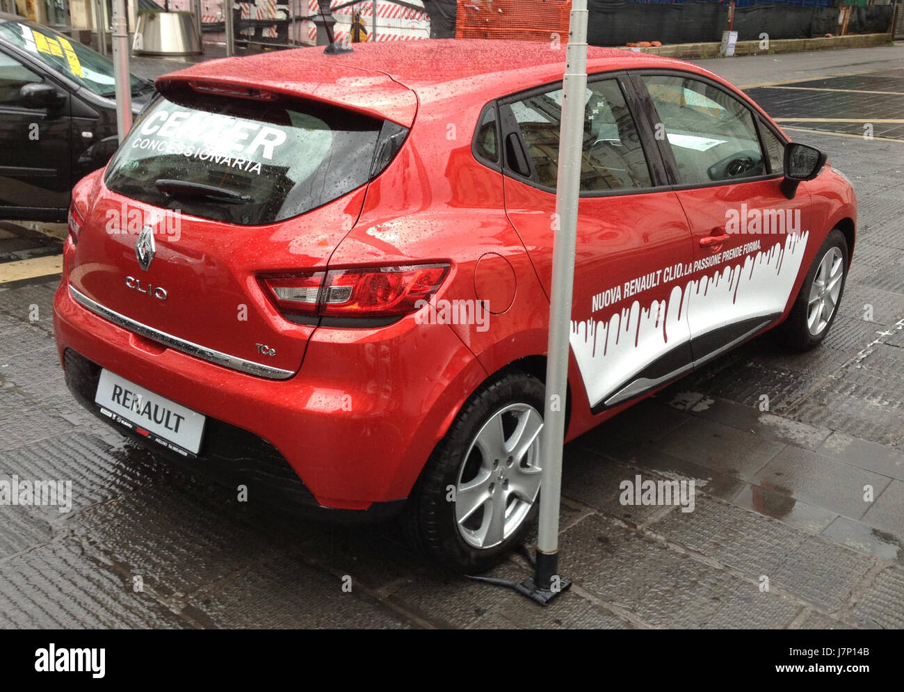 A rear view of a 2012 Renault Clio 1.2 TCe, a compact car produced by ...