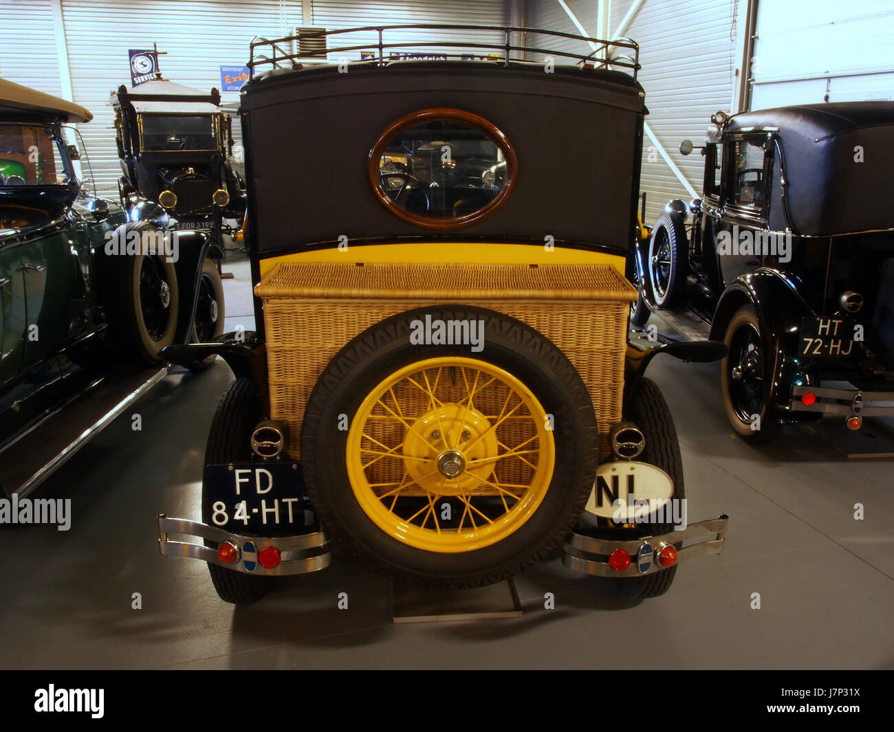 A black-and-white photograph of a 1928 Ford A Landaulette, an early ...