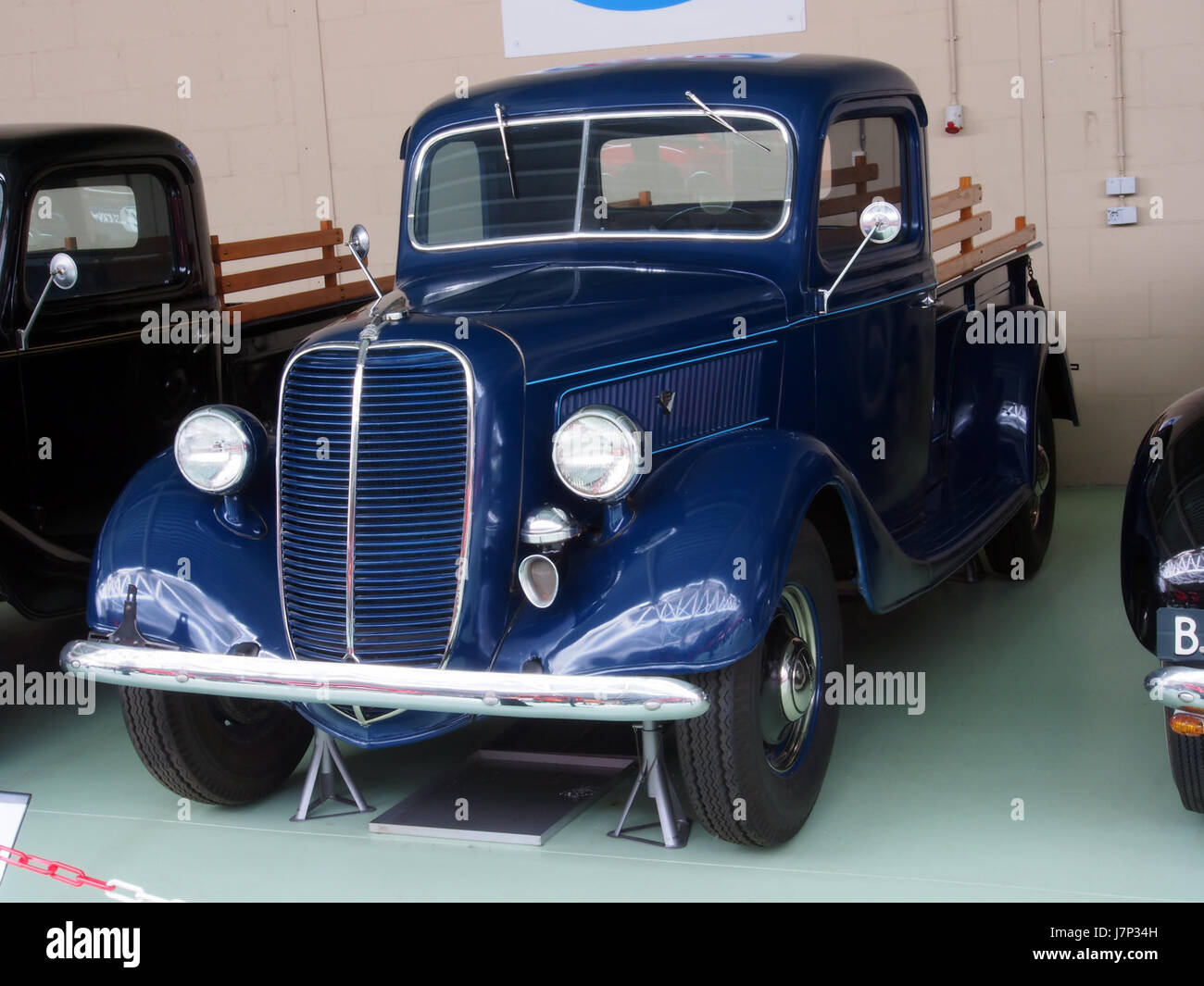 This image showcases a 1937 Ford 77 830 Pickup, a classic vehicle from ...