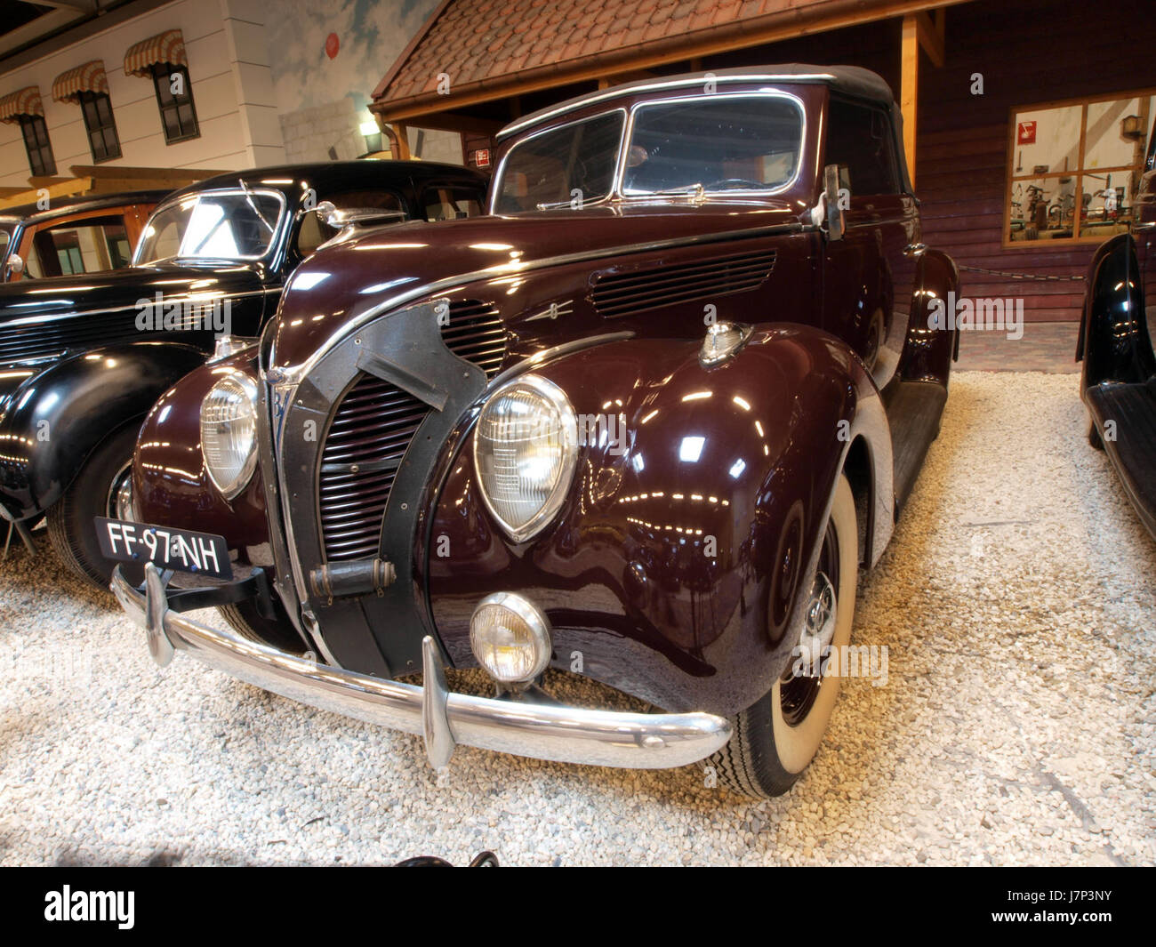 A 1938 Ford 740 Club Cabriolet, featuring classic 1930s design elements ...