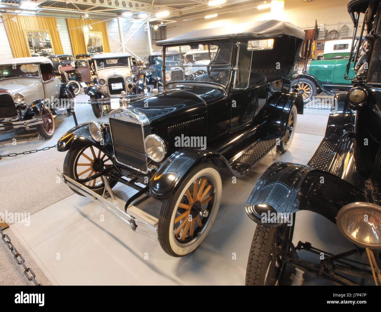 This image features a 1926 Ford Model T Open Touring car, a classic ...