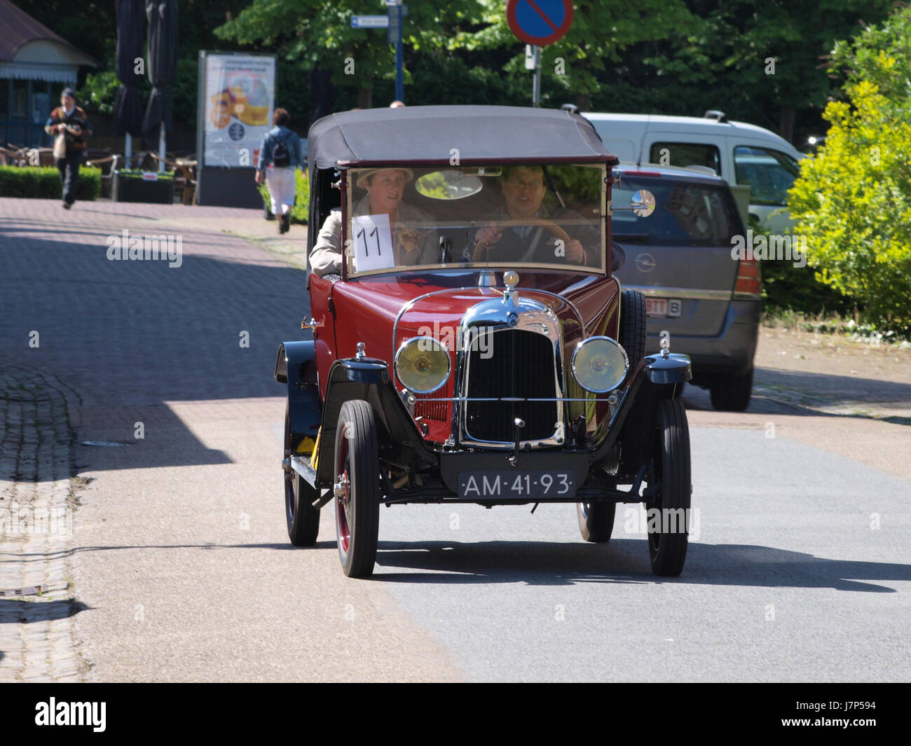 This image features a 1925 Citroen C3, an early automobile model by ...
