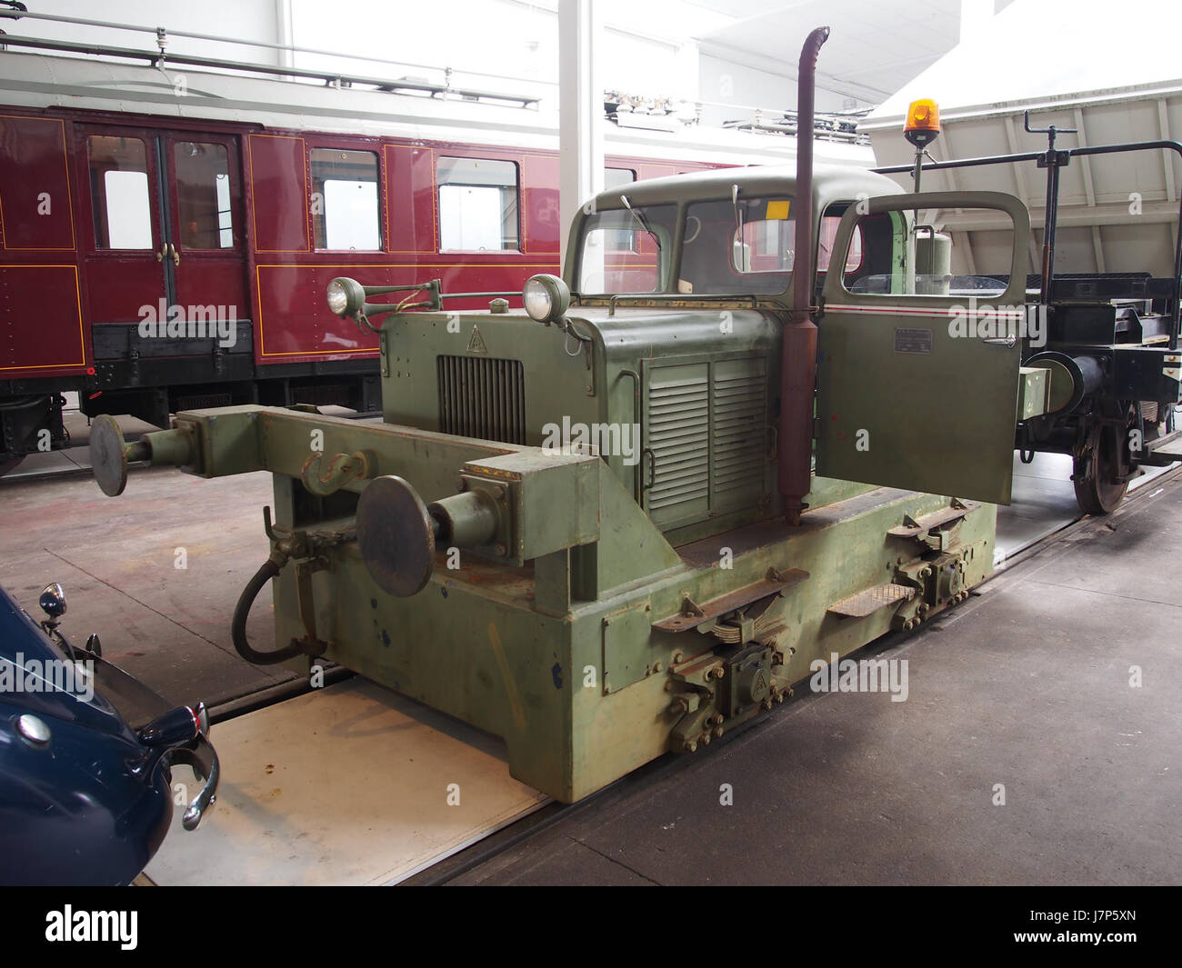 The image features a 1954 shunting engine manufactured by Pedershaab ...