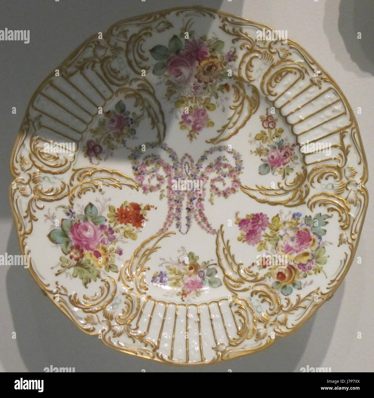 This is a 19th-century hard paste porcelain plate, possibly ...