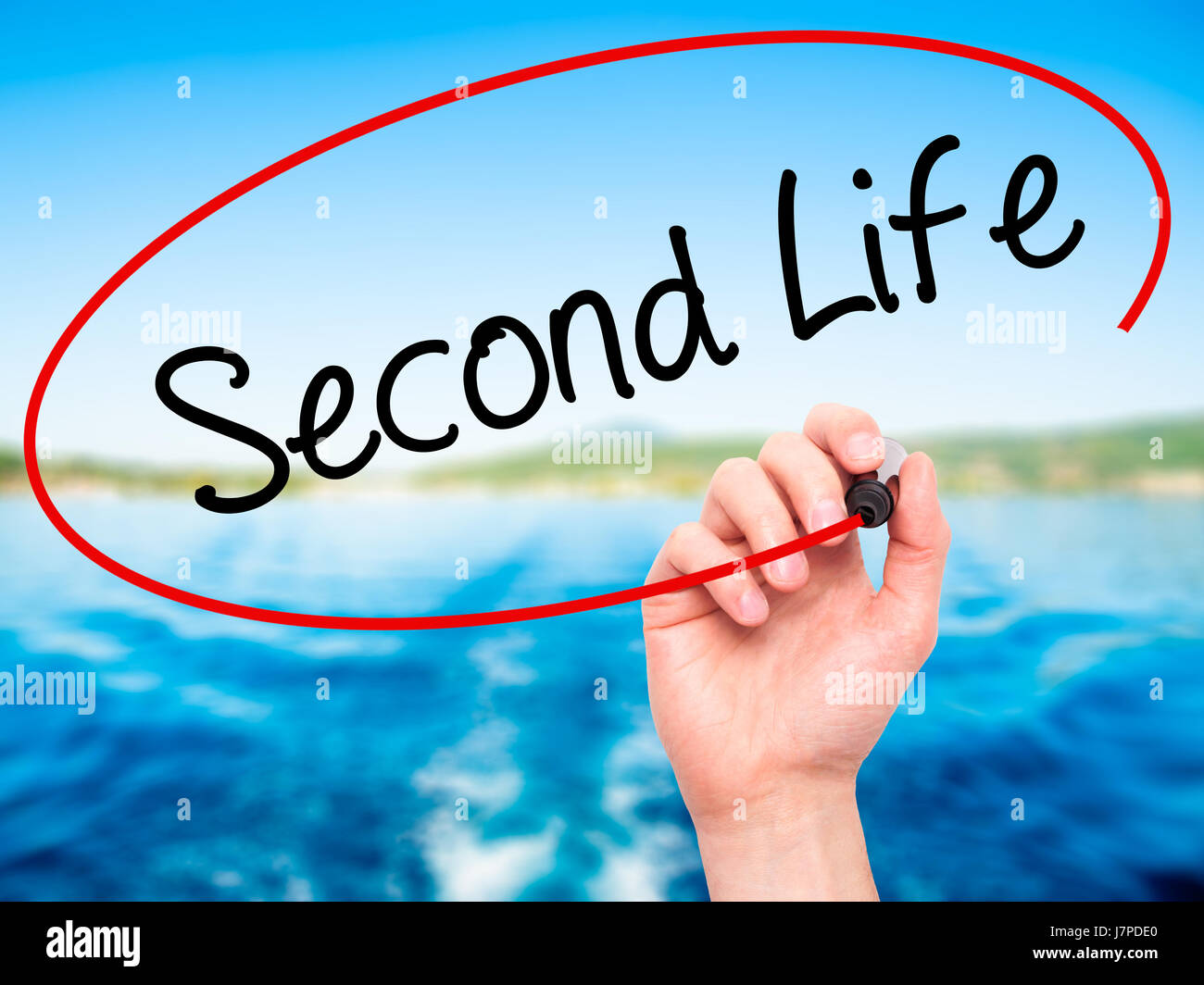 Man Hand writing Second Life with black marker on visual screen ...