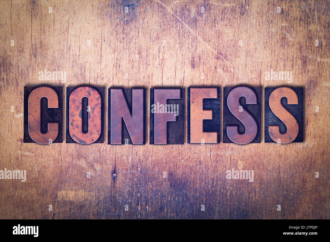 The word Confess concept and theme written in vintage wooden ...