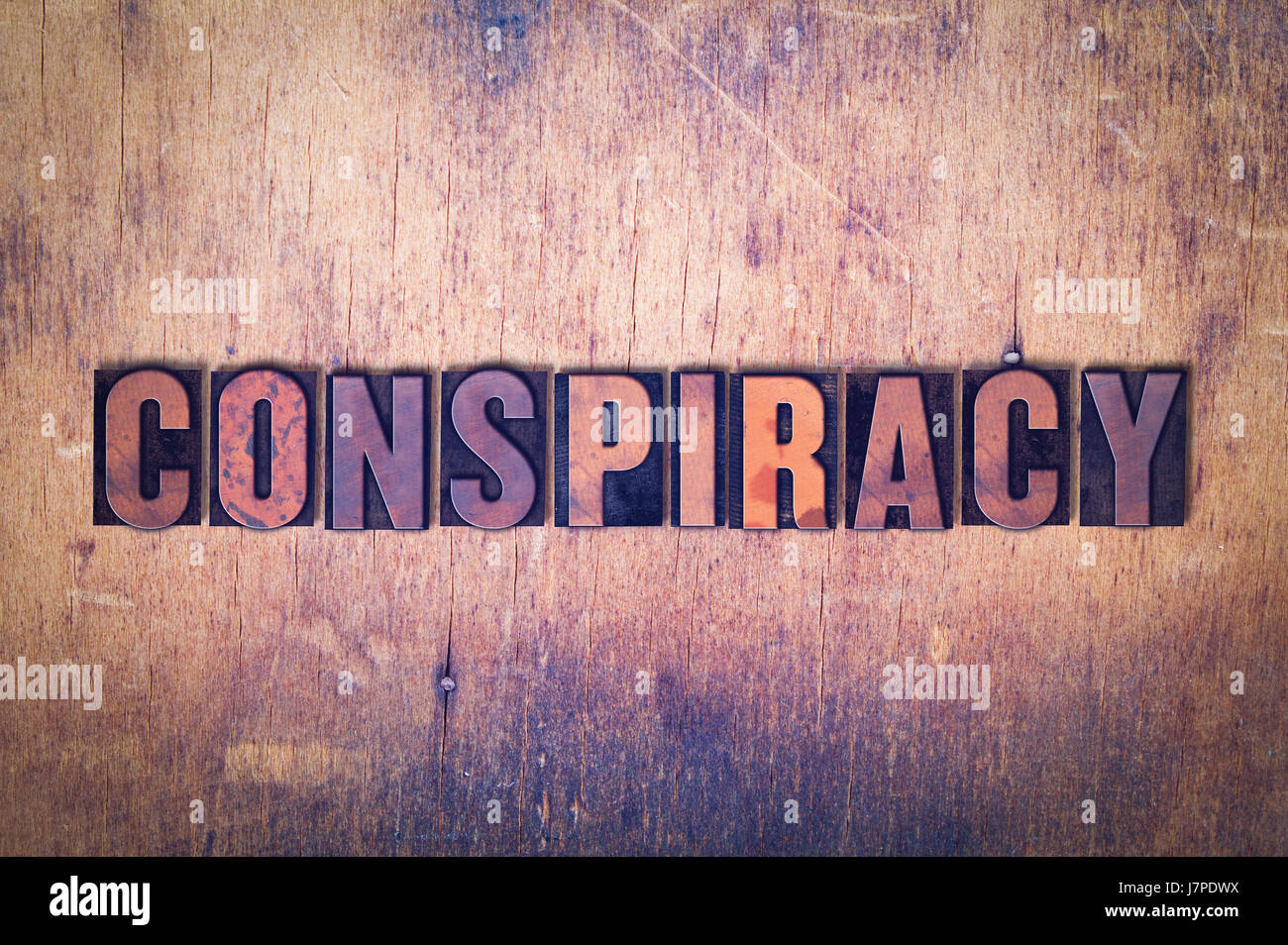 The word Conspiracy concept and theme written in vintage wooden ...
