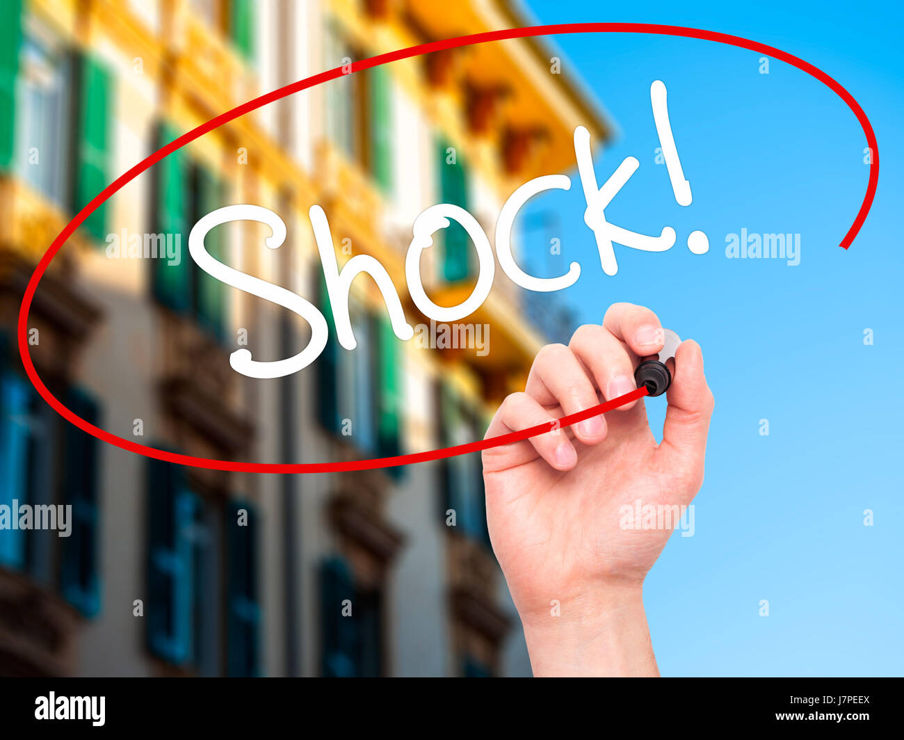 Man Hand writing Shock! with black marker on visual screen. Isolated on ...