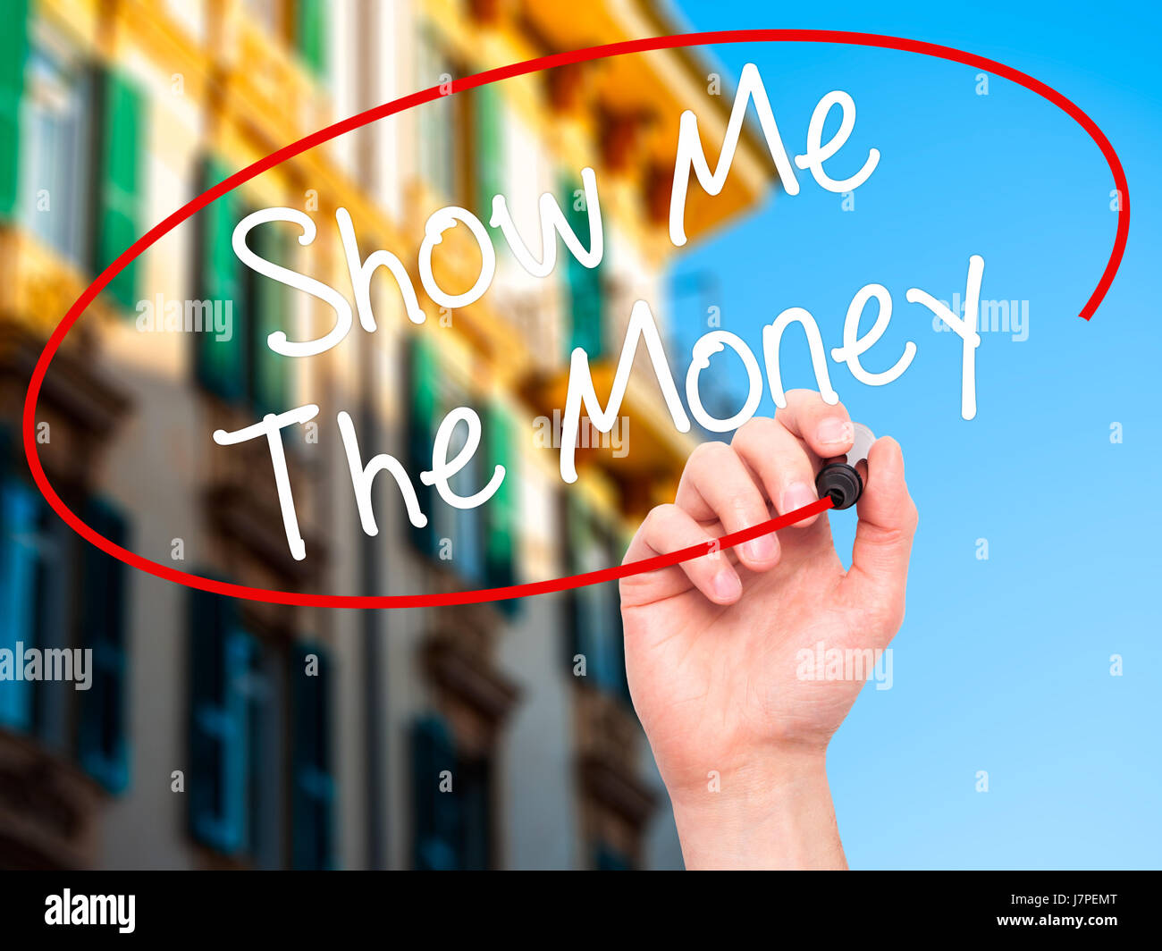 Man Hand writing Show Me The Money with black marker on visual screen ...