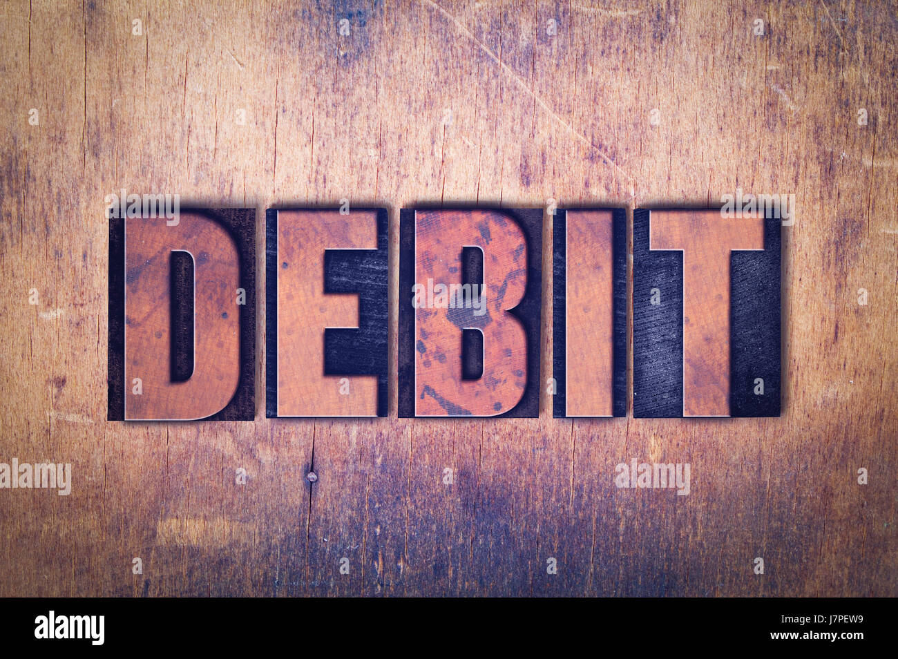 The word Debit concept and theme written in vintage wooden letterpress ...