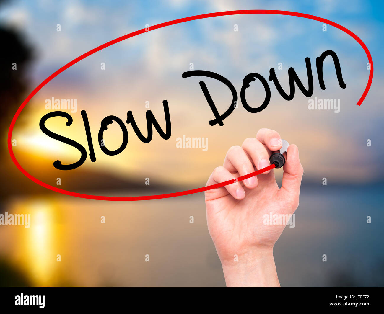 Man Hand writing Slow Down with black marker on visual screen. Isolated ...