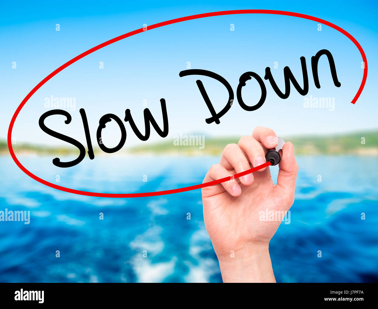 Man Hand writing Slow Down with black marker on visual screen. Isolated ...