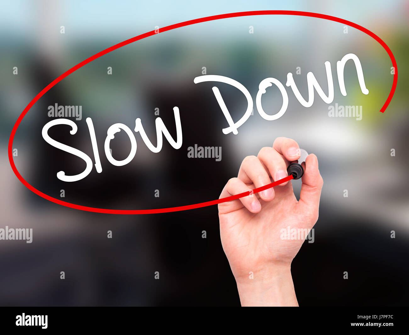 Man Hand writing Slow Down with black marker on visual screen. Isolated ...