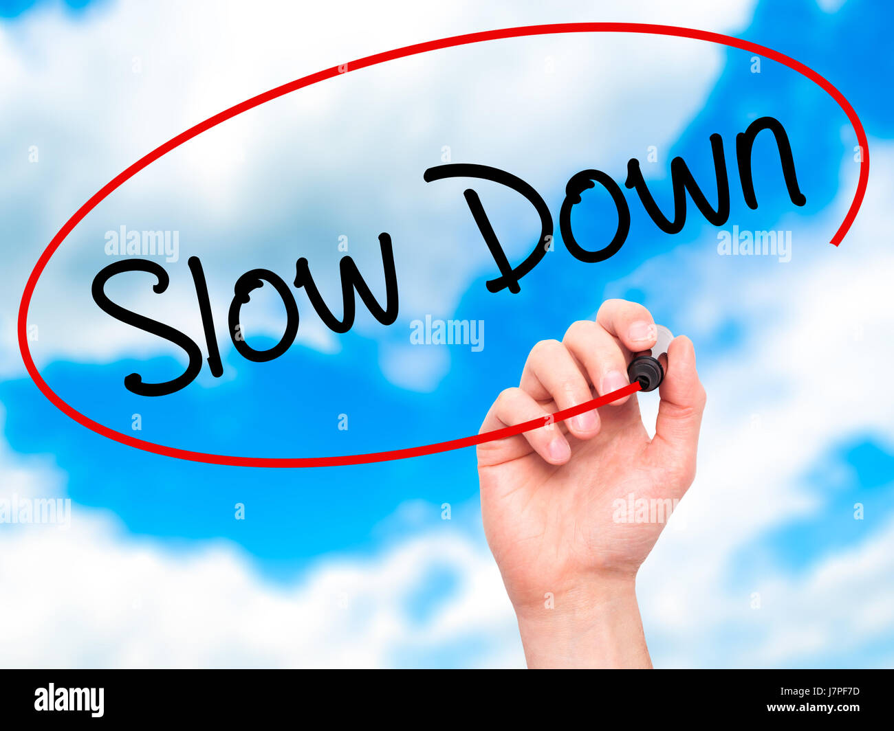 Man Hand writing Slow Down with black marker on visual screen. Isolated ...