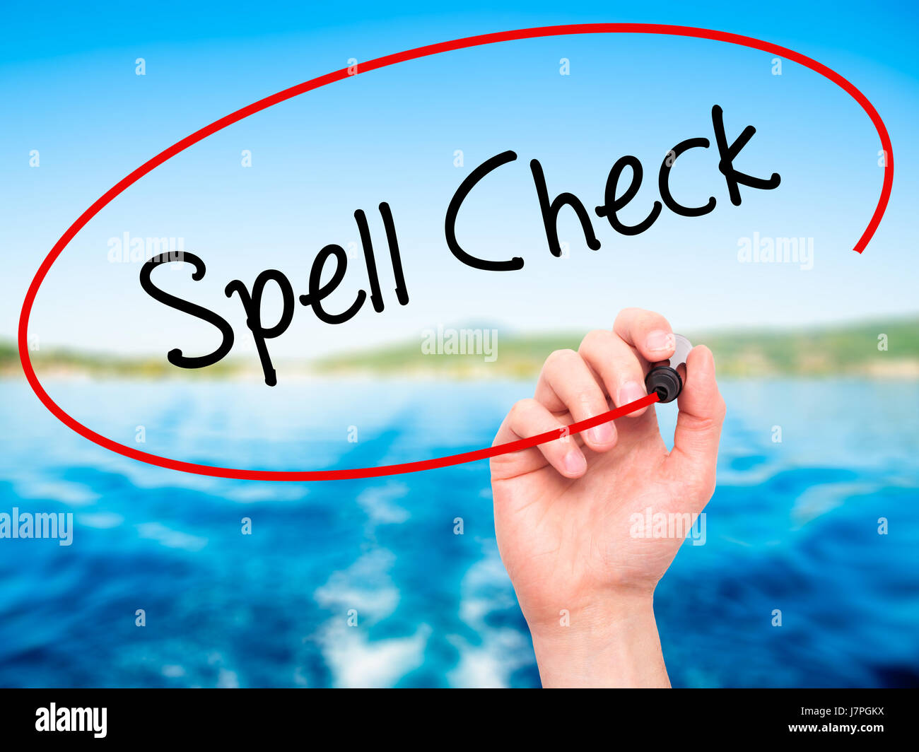 Man Hand writing Spell Check with black marker on visual screen ...