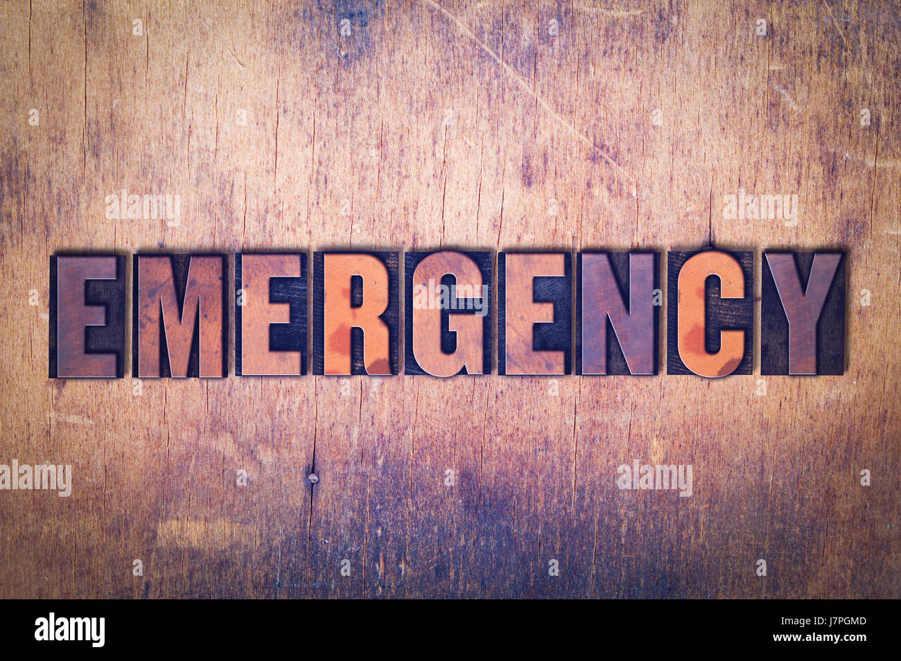 The word Emergency concept and theme written in vintage wooden ...