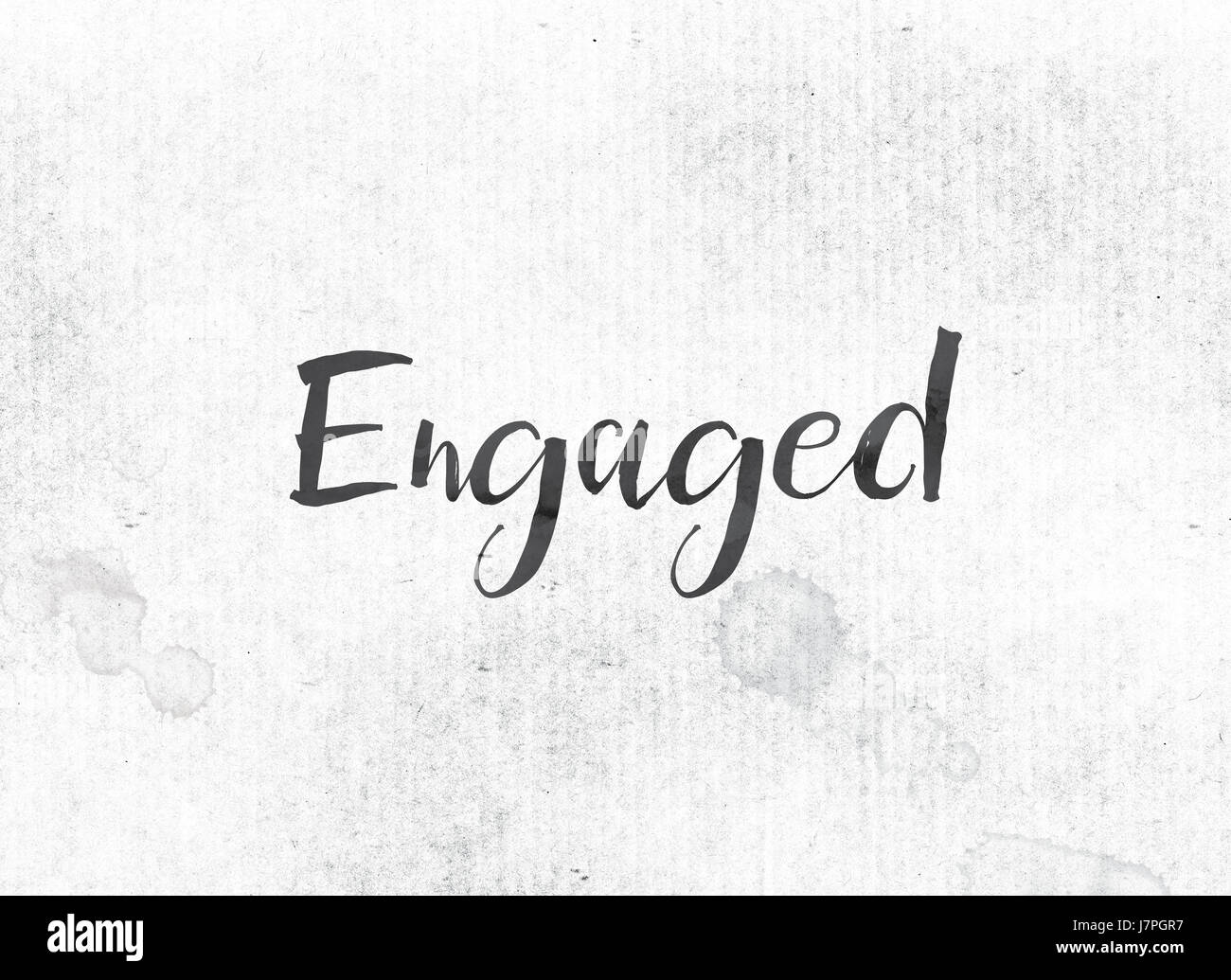The word Engaged concept and theme painted in black ink on a watercolor ...