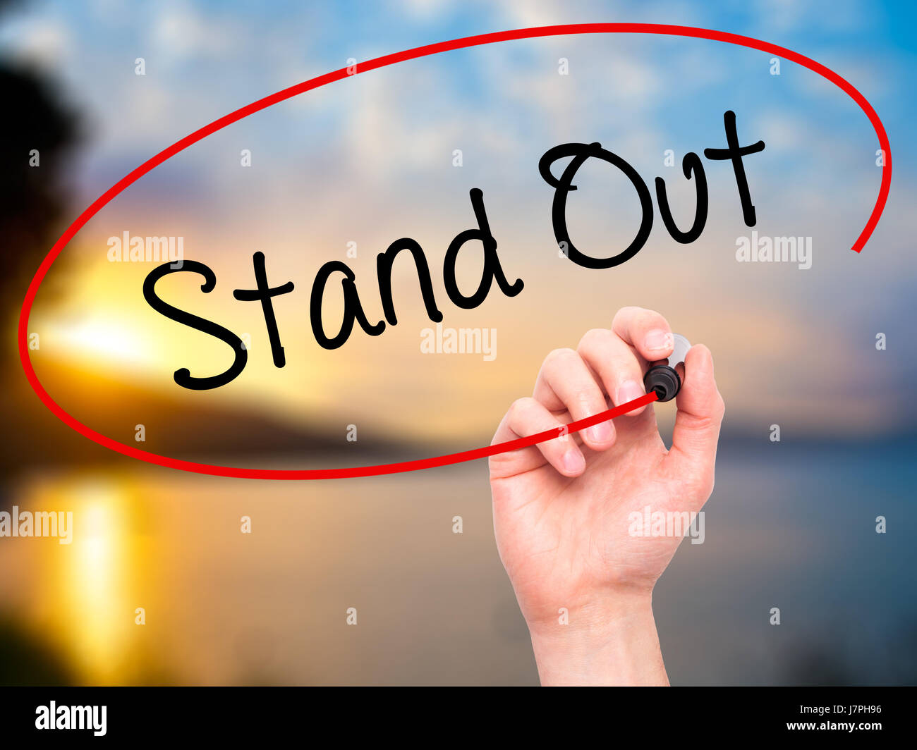 Man Hand writing Stand Out with black marker on visual screen. Isolated ...