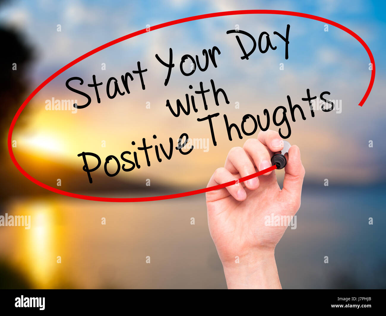 Man Hand writing Start your Dat with Positive Thoughts with black ...